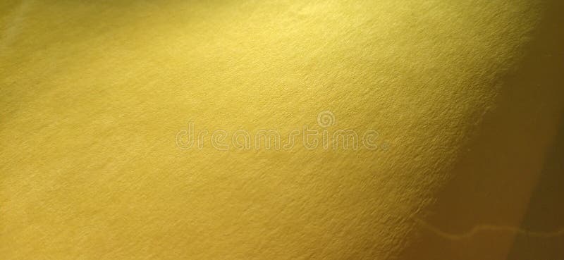 The Paper or Fabric Material is Bright Yellow. Close-up. Slightly ...
