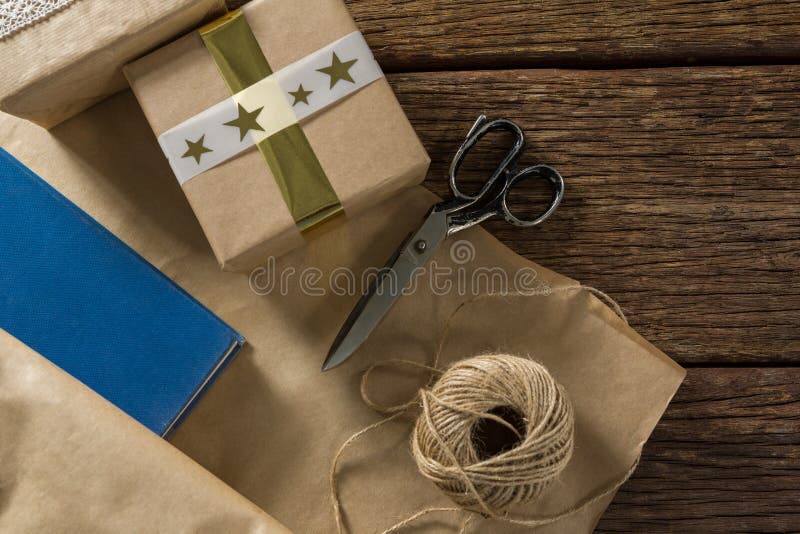 Paper with Gift Box by Scissor and Thread Spool Stock Image - Image of ...