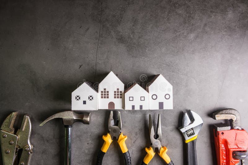 Paper House and Construction Tools on Stone Pattern Background with ...