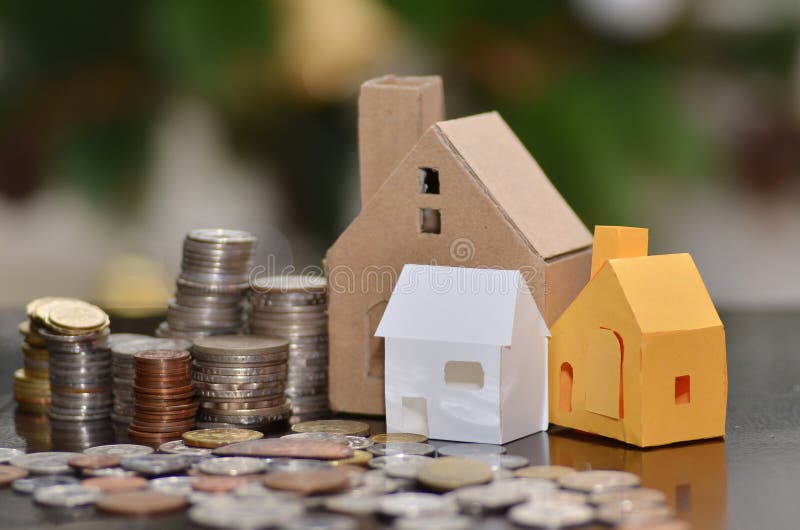 Paper House and Stacks of Coins Standing Stock Photo - Image of paper ...
