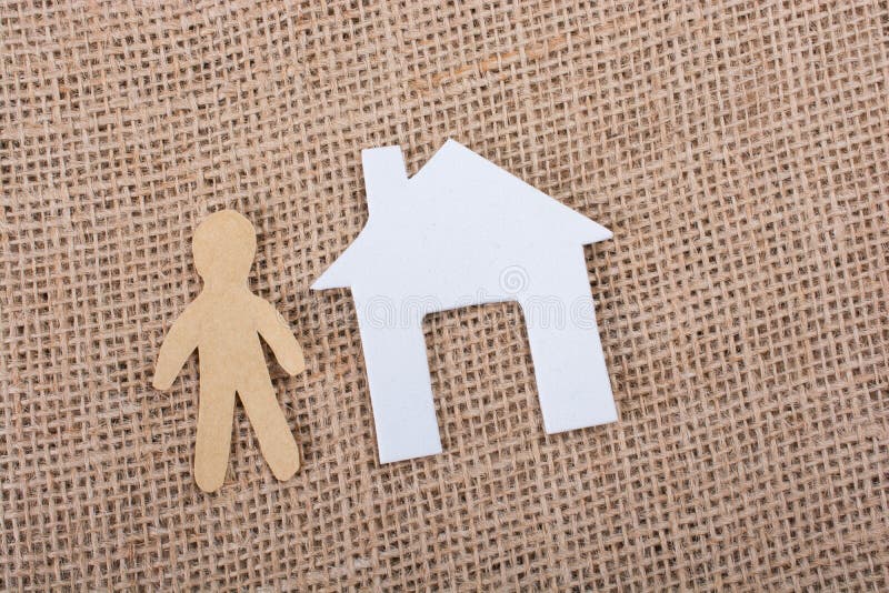 Paper Man Shape beside a House Shape Stock Photo - Image of concept ...