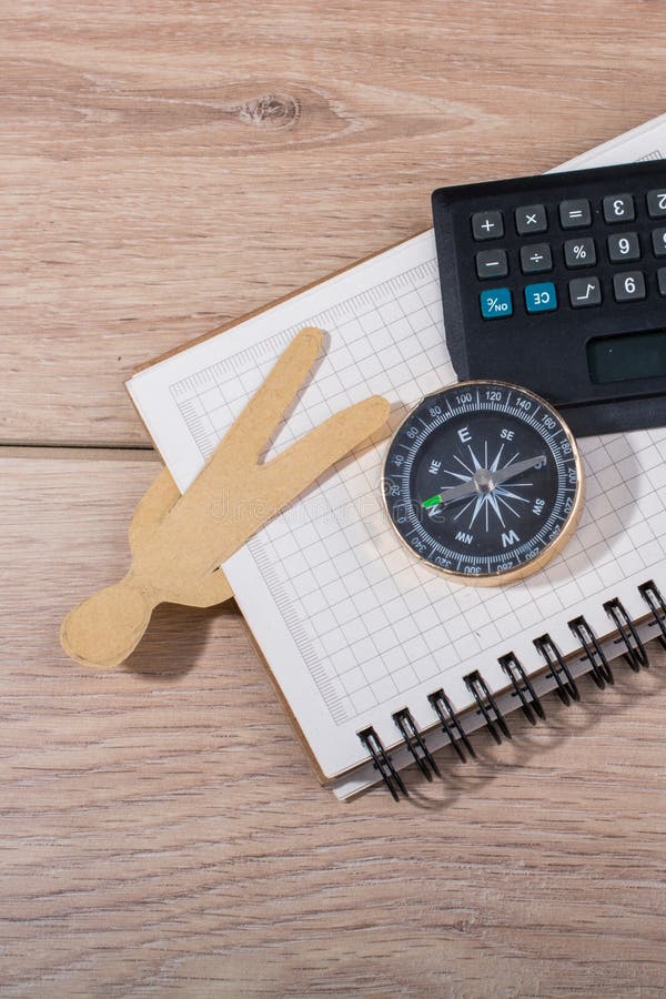 Men Shape Cut Out of Paper on Notebbok Stock Photo - Image of compass ...