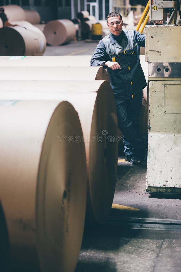 Paper mill factory worker stock photo. Image of brown - 92877890