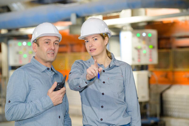 Workers with One in the Foreground Stock Image - Image of team ...
