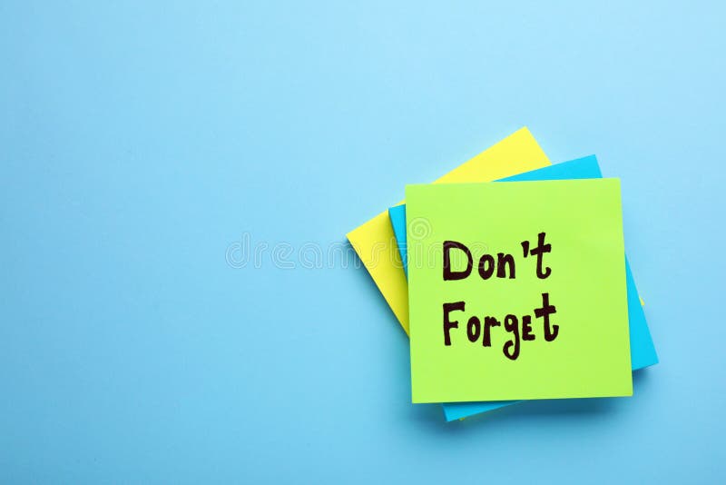 Paper Note with Phrase Don`t Forget on Light Blue Background, Top View ...