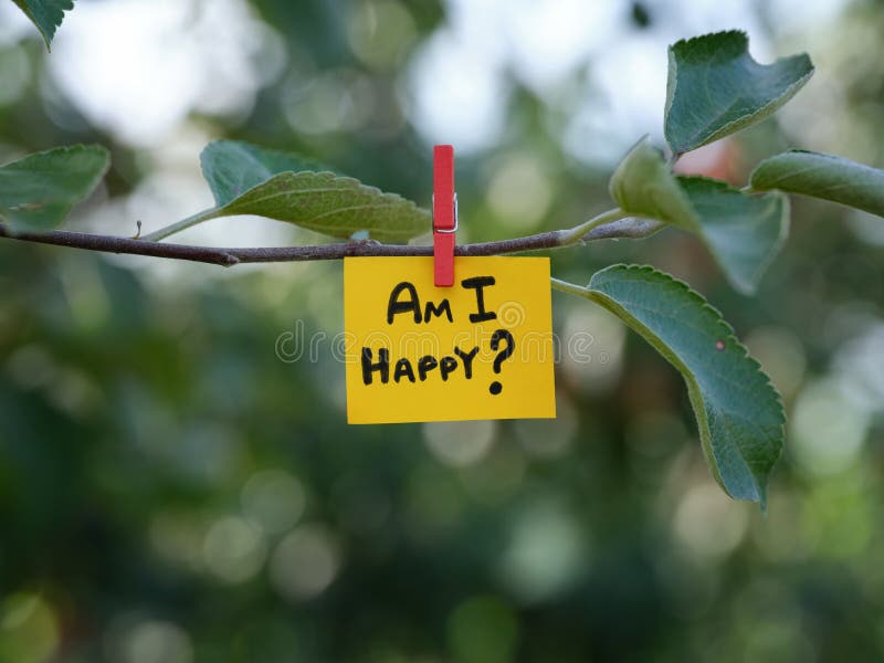 A Paper Note with the Question am I Happy on it Attached To a Tree with ...