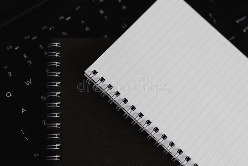 2 Paper Notepads on Top of Laptop Keyboard Stock Image - Image of ...