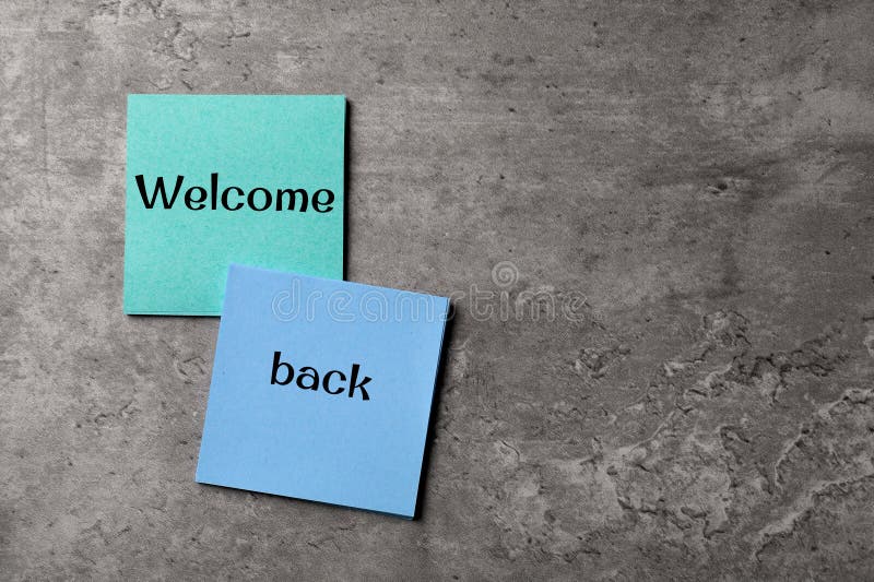 Paper Notes with Words Welcome Back on Grey Table, Top View. Space for ...