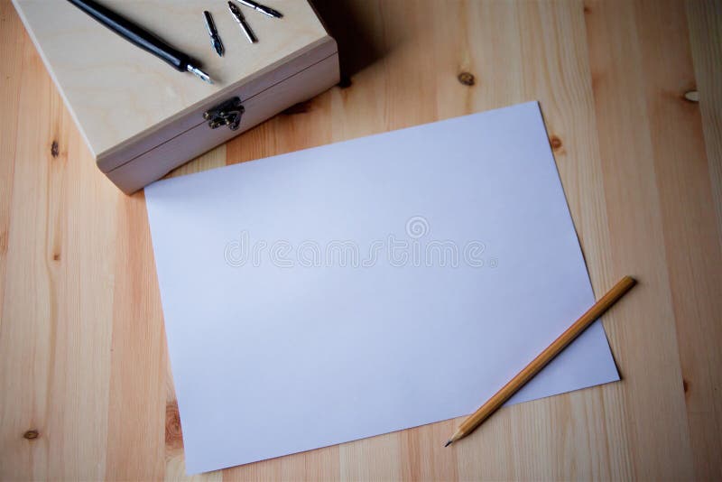 Paper and Objects for Writing and Drawing Lie on the Surface of the ...