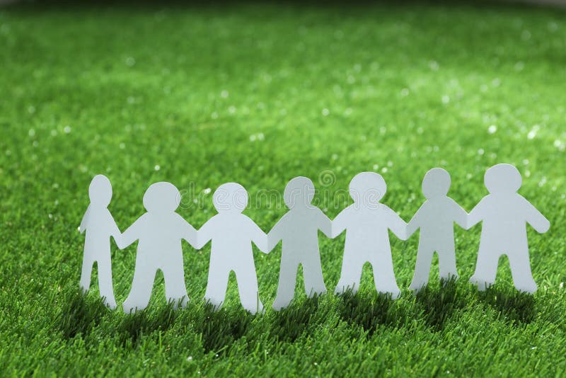 Paper People Chain on Green Grass. Unity Concept Stock Photo - Image of ...