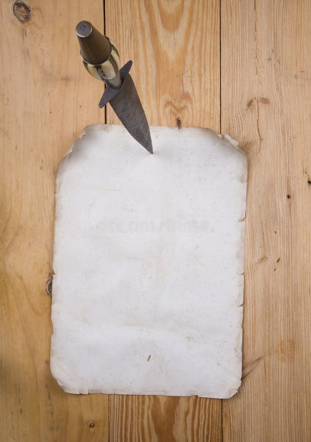 Paper pinned with a knife stock image. Image of pinned - 5339157