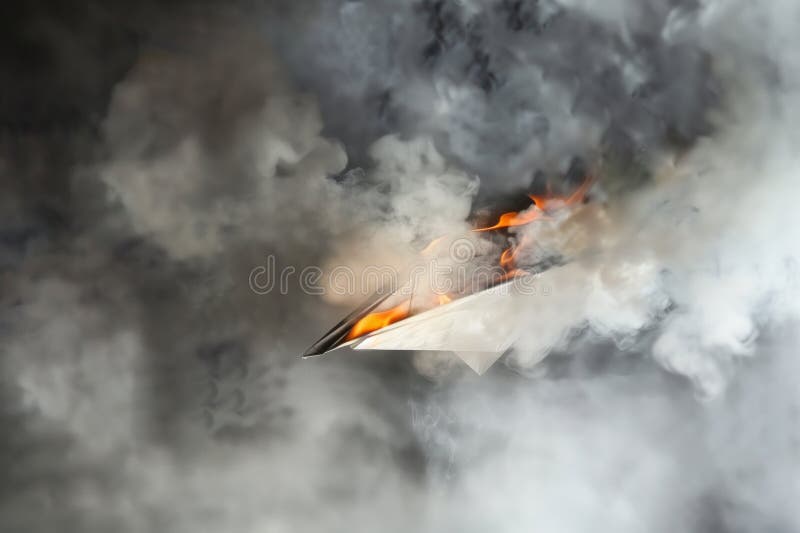 Paper Plane Ablaze Tumbling through Smoke Stock Photo - Image of ablaze ...