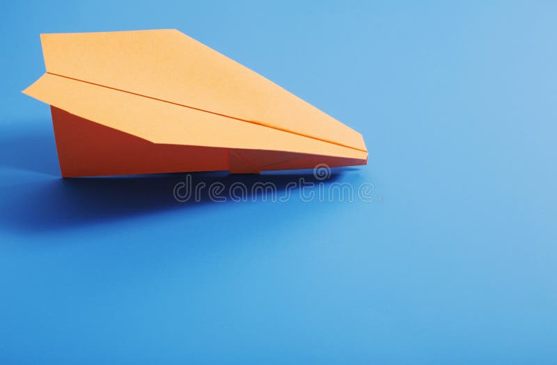 Paper Plane on Blue Color Background Stock Photo - Image of table ...