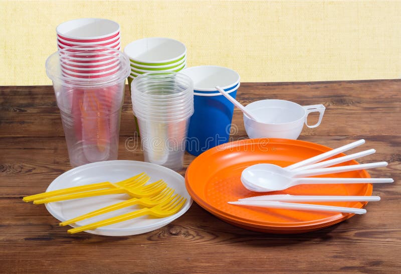 Paper and Plastic Disposable Cutlery on a Rustic Table Stock Photo ...