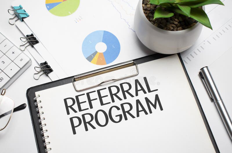 Paper with Referral Program on the Table, Calculator and Money Stock ...