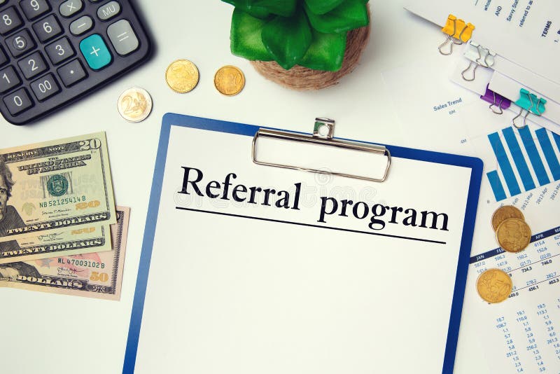 Paper with Referral Program on the Table, Calculator and Money Stock ...