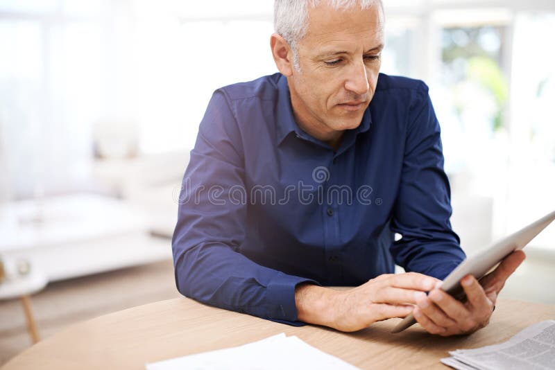 Paper, Remote Work and Senior Man with Tablet in Home Office for ...