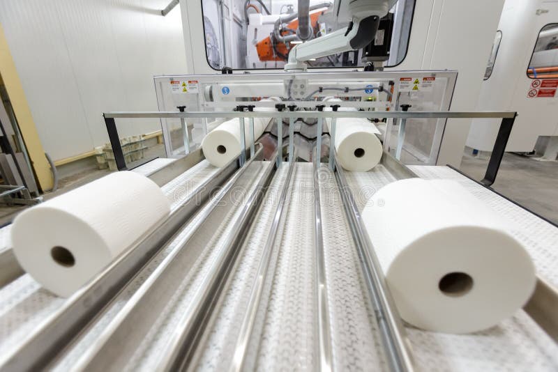 Paper rolls on conveyor stock image. Image of material - 94613979