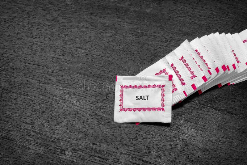 Paper Salt Packets Lined Up in a Row Stock Photo - Image of kitchen ...