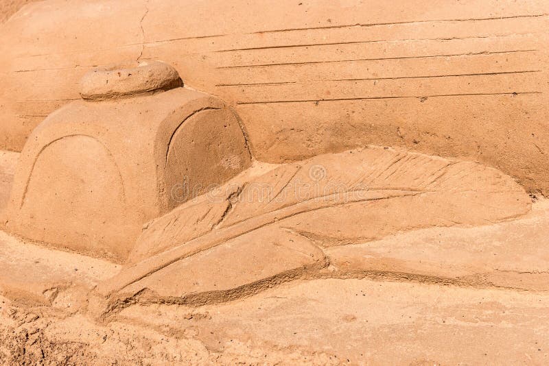 Paper Scroll with Feather Pen and Ink Pot in Sand Stock Photo - Image ...