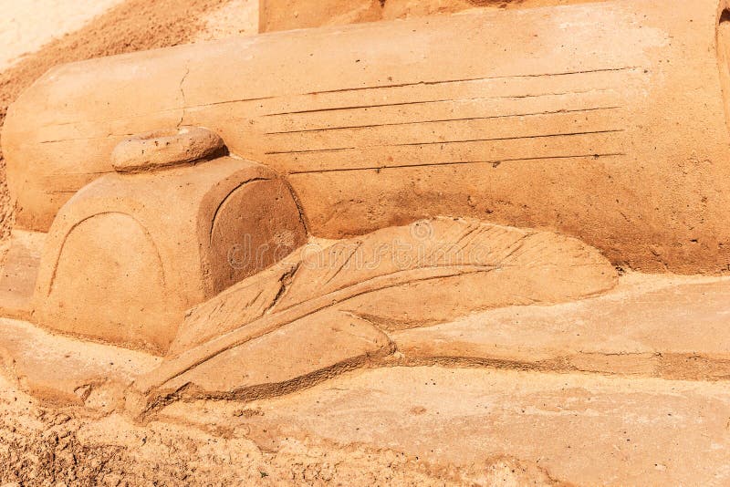 Paper Scroll with Feather Pen and Ink Pot in Sand Stock Image - Image ...