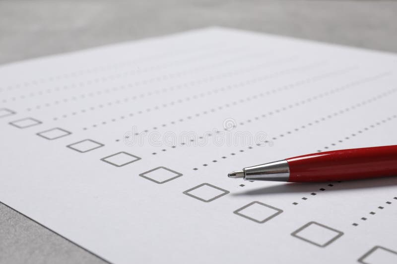 Paper Sheet with Checkboxes and Pen on Light Grey Table, Closeup ...