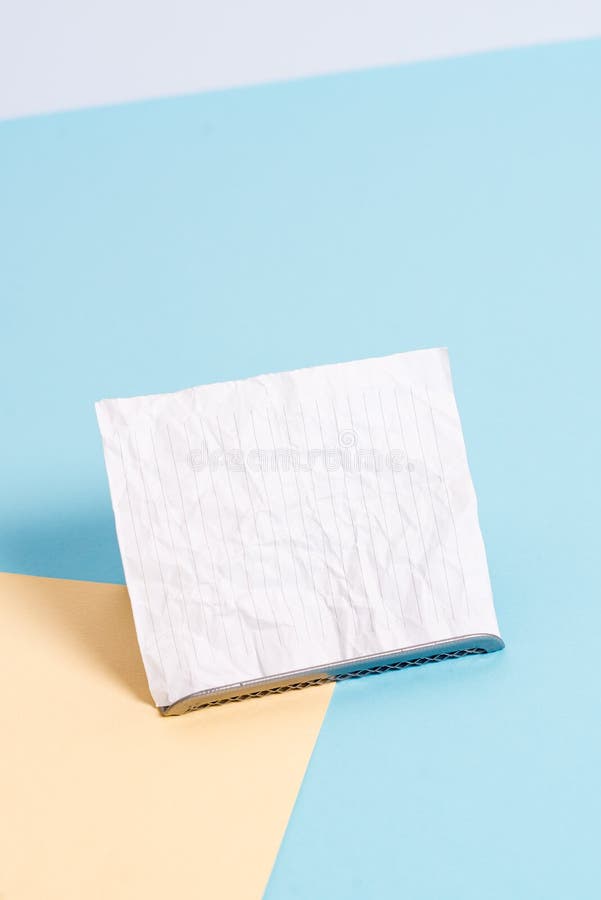 Paper Sheet Placed Tilted on a Buffer Wire with a Soft Pastel Backdrop ...