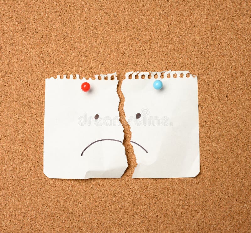 Paper Sheet with a Sad Emotion Attached by a Button on a Brown Board ...