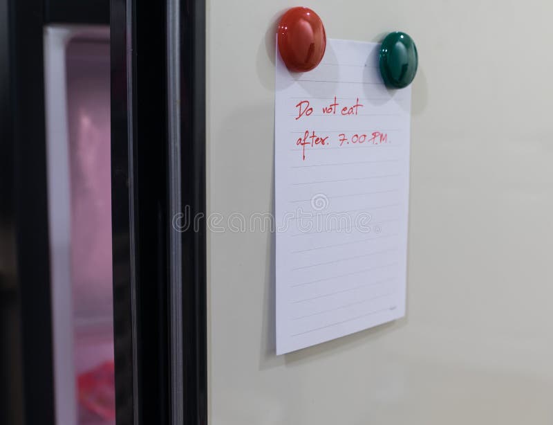 Paper Sheet Write Do Not Eat after 7.00 Pm on Refrigerator Door Stock ...