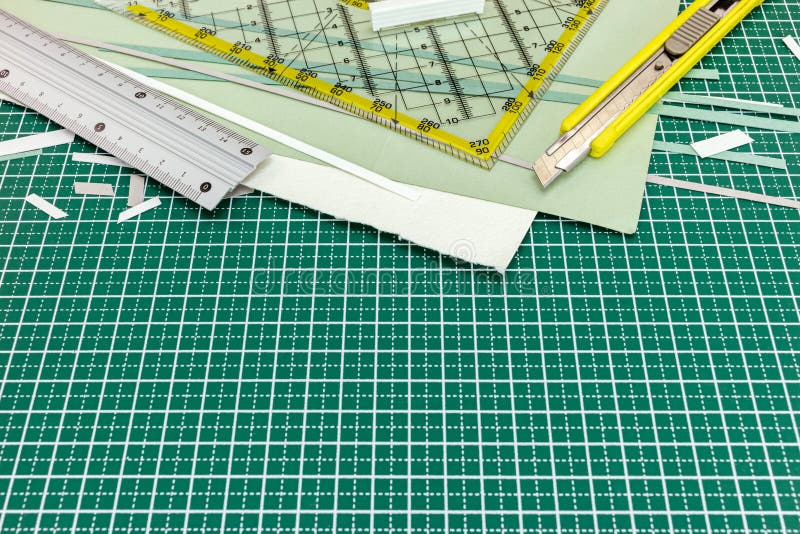 Paper Sheets with Metal Ruler and Utility Knife on Green Cutting Stock ...