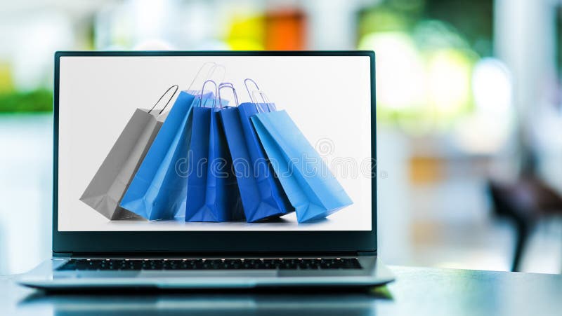 Paper Shopping Bags on Laptop Computer Screen. Shopping Online Stock ...