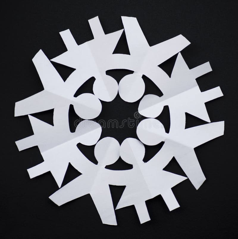 PAPER SNOWFLAKE CUT AS PEOPLE HOLDING THEIR HANDS Stock Image - Image ...