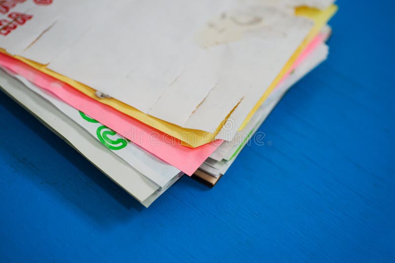 Paper stack on blue desk stock photo. Image of organization - 72545530