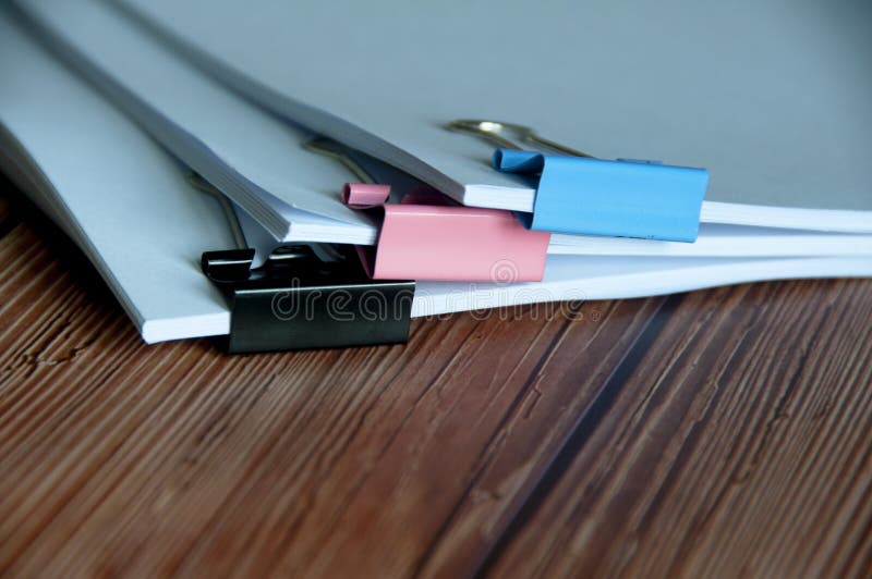 Paper Stack of Clipped Pile of Documents on Wooden Desk. Copy Space and ...