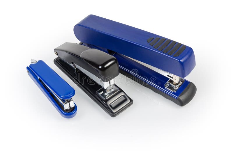 Paper Staplers Different Sizes on a Light Surface Stock Photo - Image ...