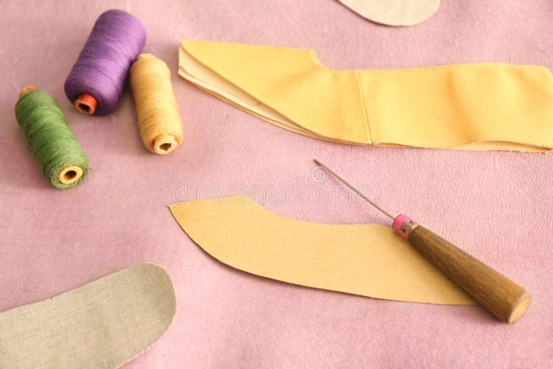Paper Template with Awl and Threads on Leather in Workshop Stock Photo ...