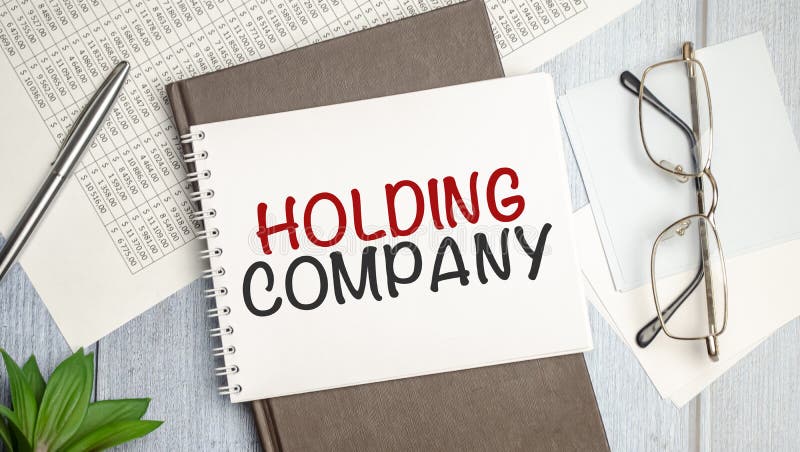 Paper with Text HOLDING COMPANY on the Table on the Chart Stock Photo ...