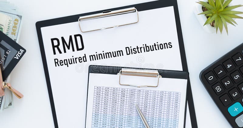 Paper with Text RMD Required Minimum Distributions on a Table Stock ...