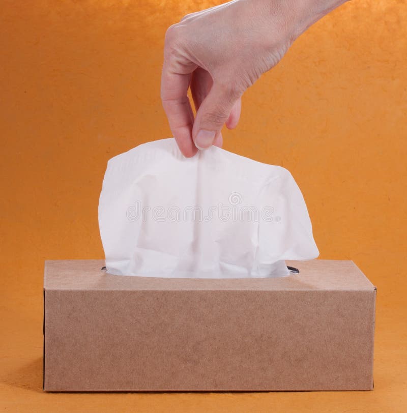 Paper Tissue Box on Orange Background Stock Photo - Image of hand ...