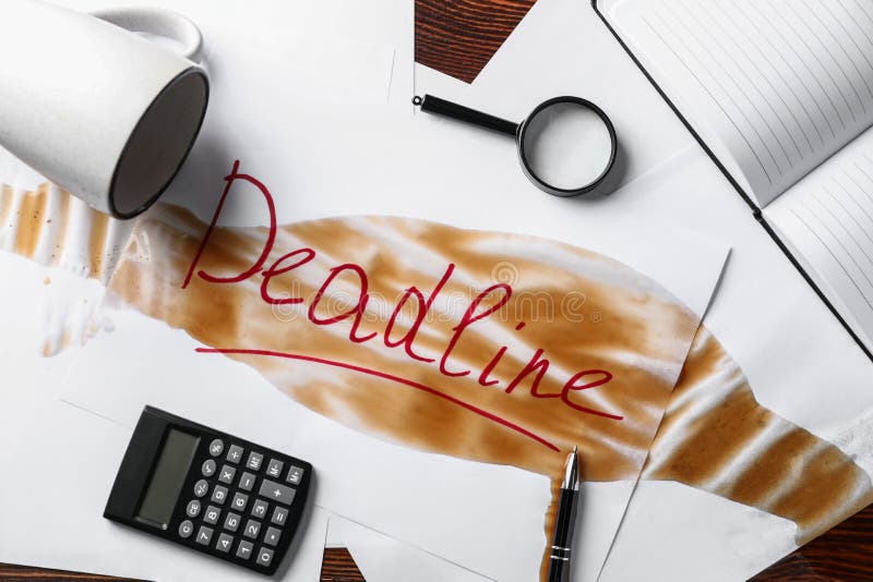 Paper with Word DEADLINE and Spilled Coffee on Table Stock Photo ...