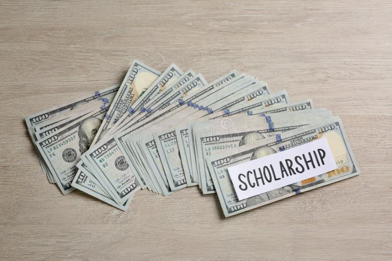 Paper with Word Scholarship and Banknotes on Wooden Table, Flat Lay ...