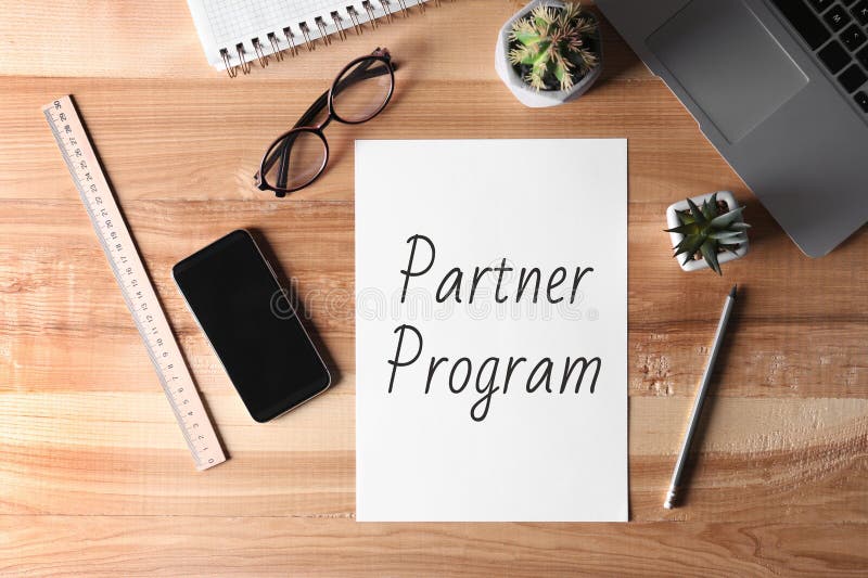 Paper with Words Partner Program on Wooden Office Table. Workplace with ...