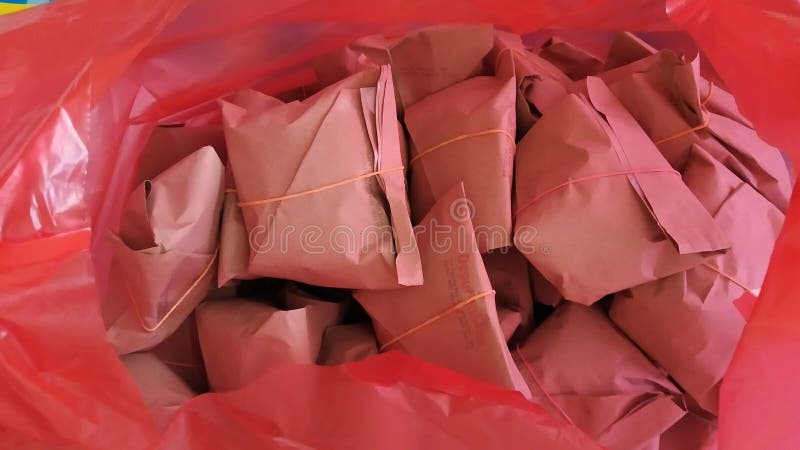 Paper Wrapped Rice Ready To Be Shared Stock Image - Image of paper ...