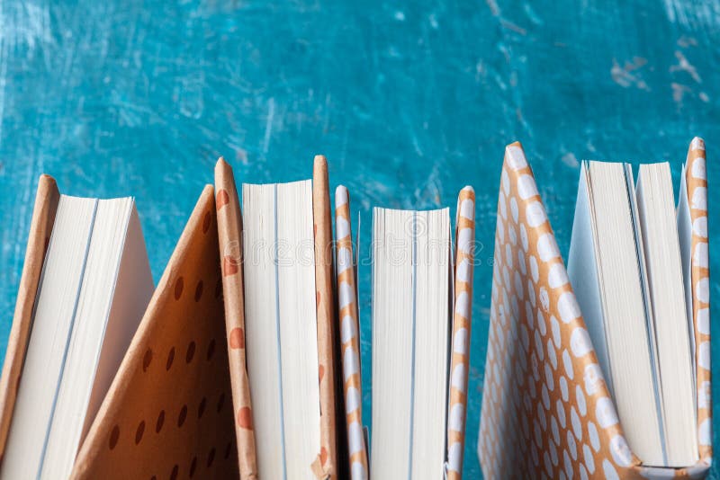 Paperback Books on a Table Creative Photo. Stock Photo - Image of ...