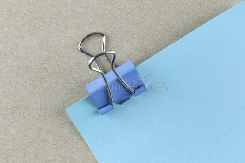 PaperClip Action Pin in Blue Paper Note on Brown Cardboard. Stock Image ...