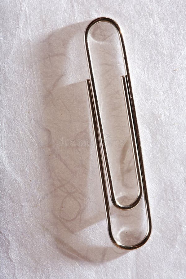 Paperclip on paper stock image. Image of office, shiny - 2765629