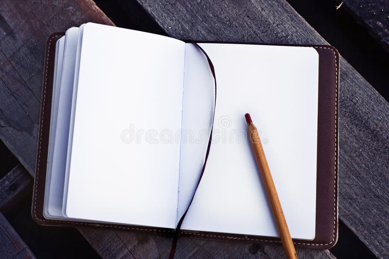 Papers in a Copybook with Pen on Wooden Table Stock Image - Image of ...