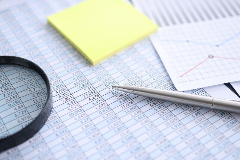 Papers with Digital Indicators Magnifier and Pen Stock Photo - Image of ...