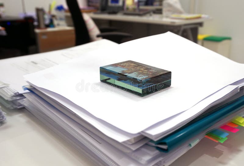 Paperweight on documents stock photo. Image of glass - 56013964