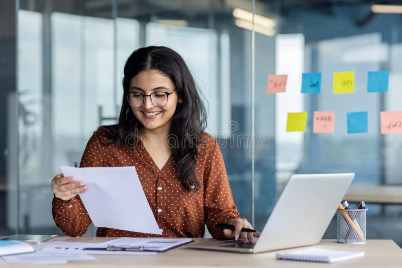 Office Work. Portrait of a Young Asian Man Working on a Laptop and ...